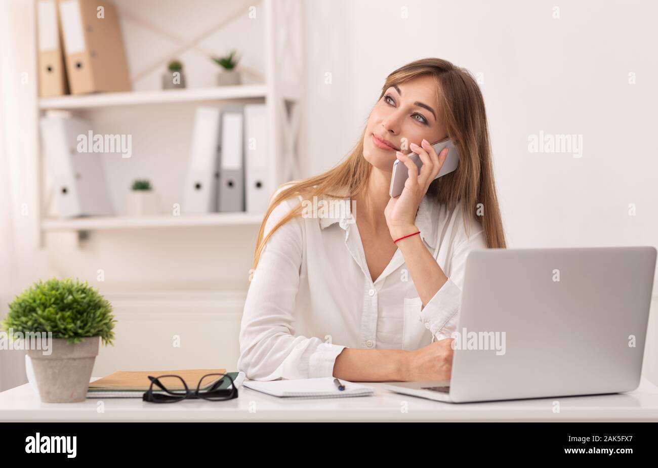 Office Lifestyle. Business Girl Talking On Phone Calling Client Sitting ...