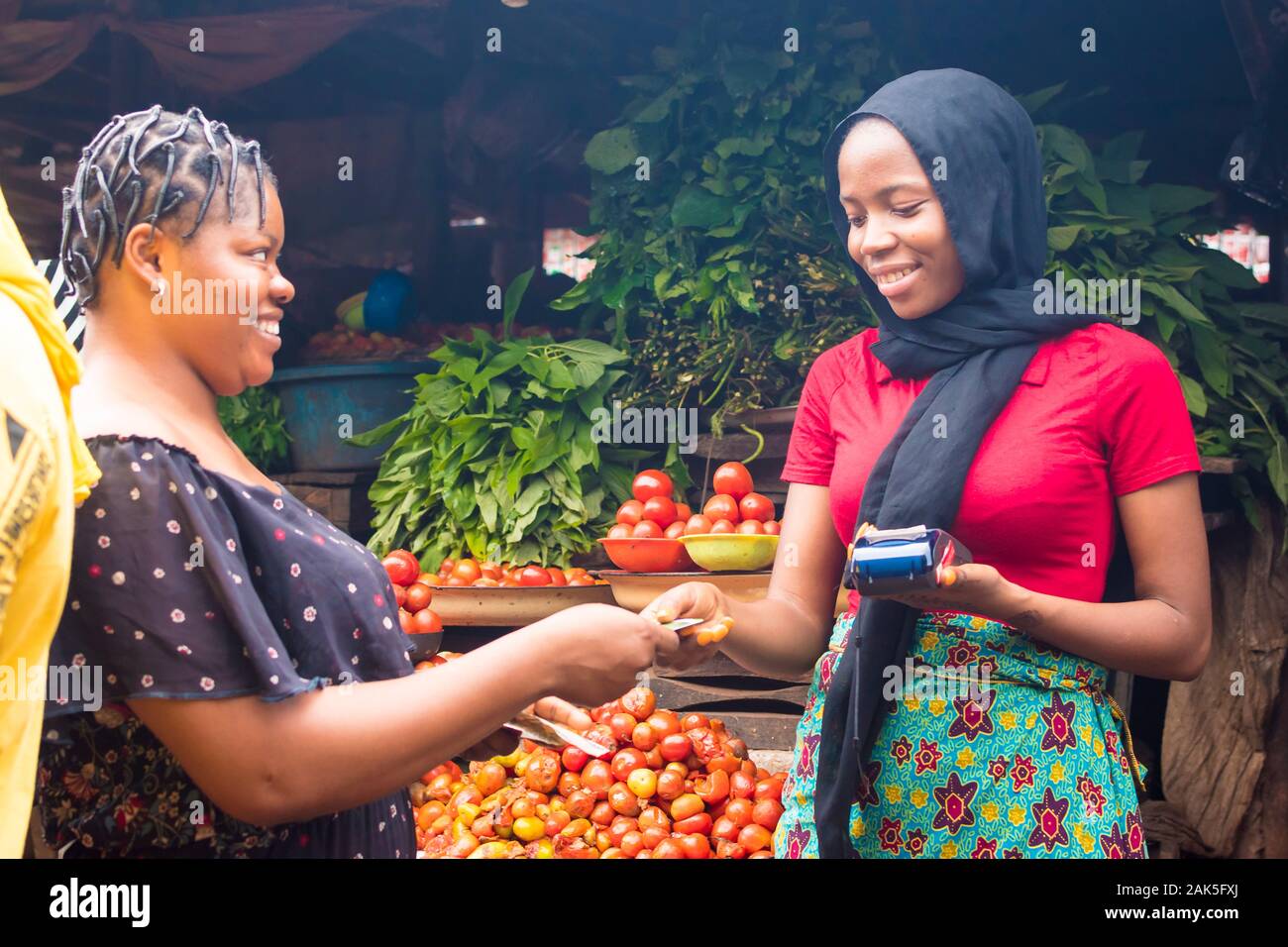 close up of an african woman selling food stuff in a local african ...