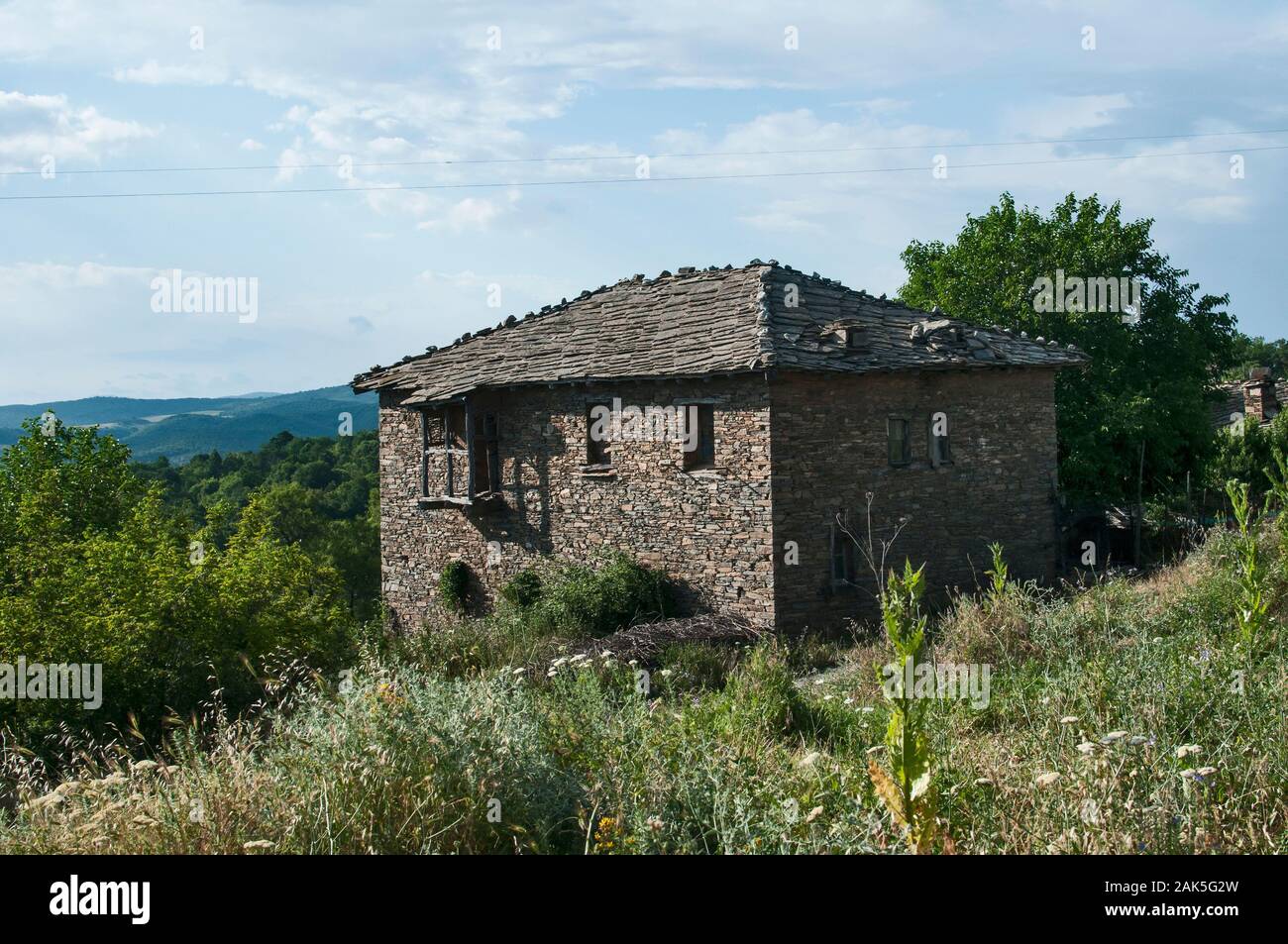 Old rural country stone house facade in sunny summer day Stock Photo ...