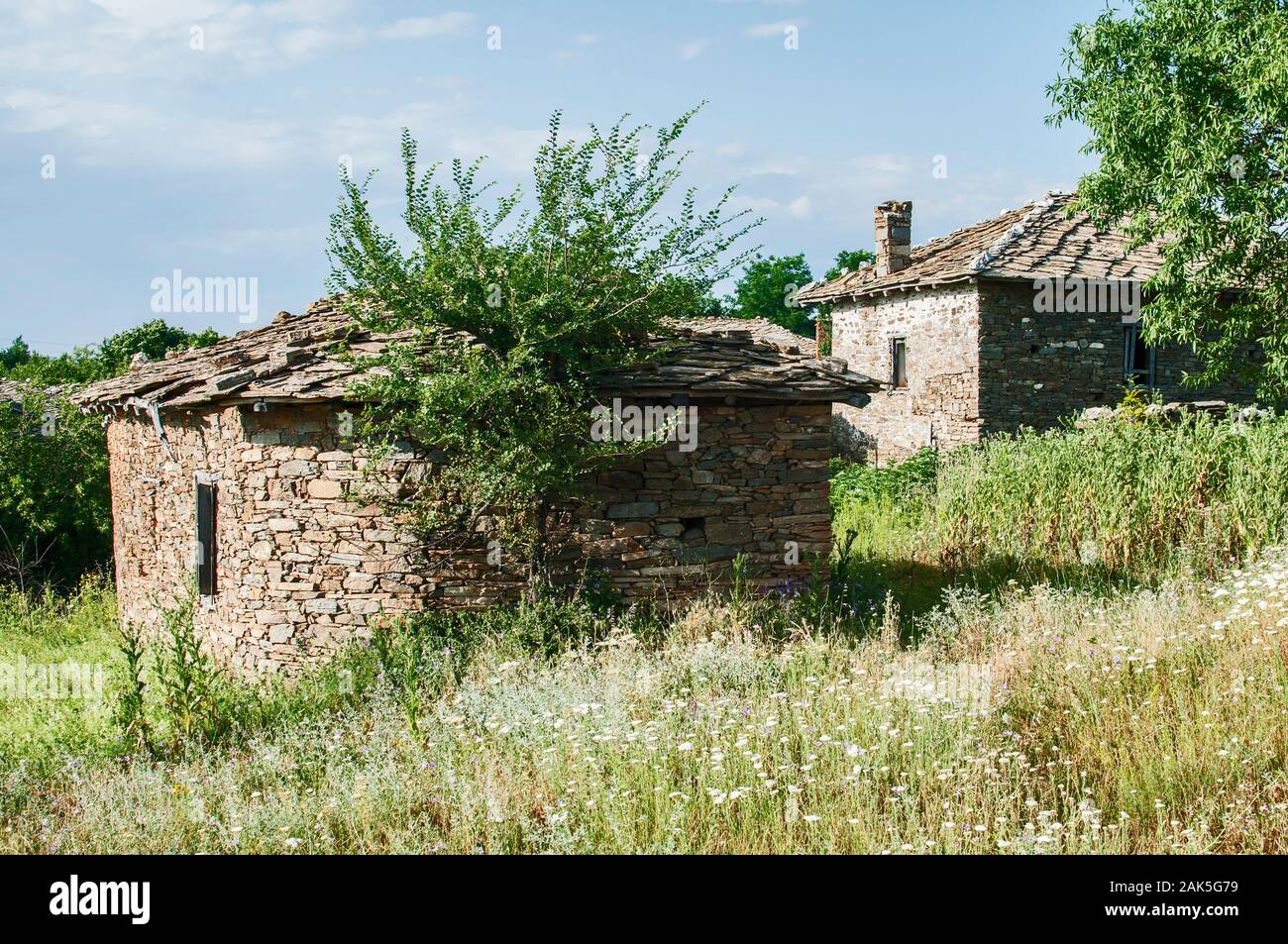 Old rural country stone house facade in sunny summer day Stock Photo ...