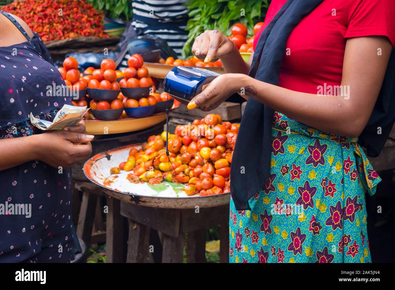 close up of an african woman selling food stuff in a local african ...