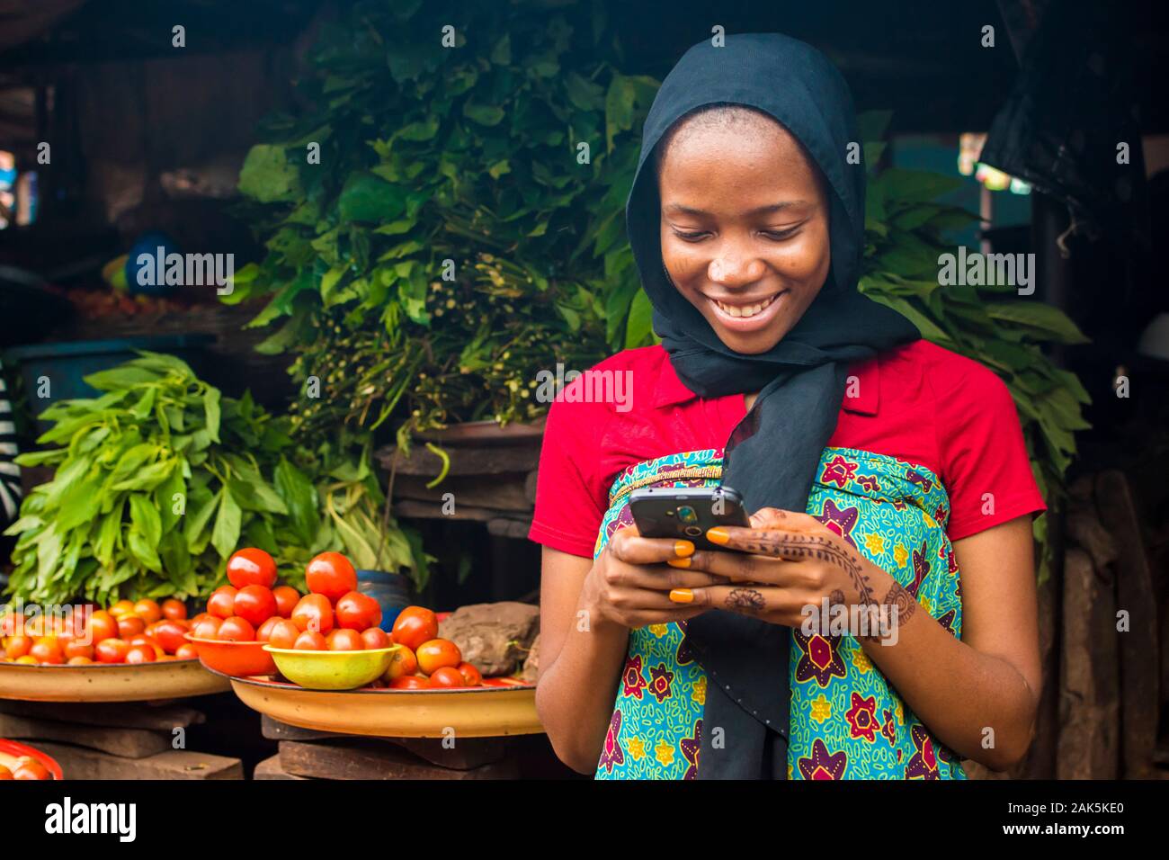 African woman selling tomatoes in hi-res stock photography and images ...