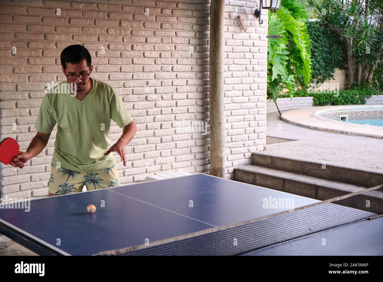 a young men playing table tennis Stock Photo - Alamy
