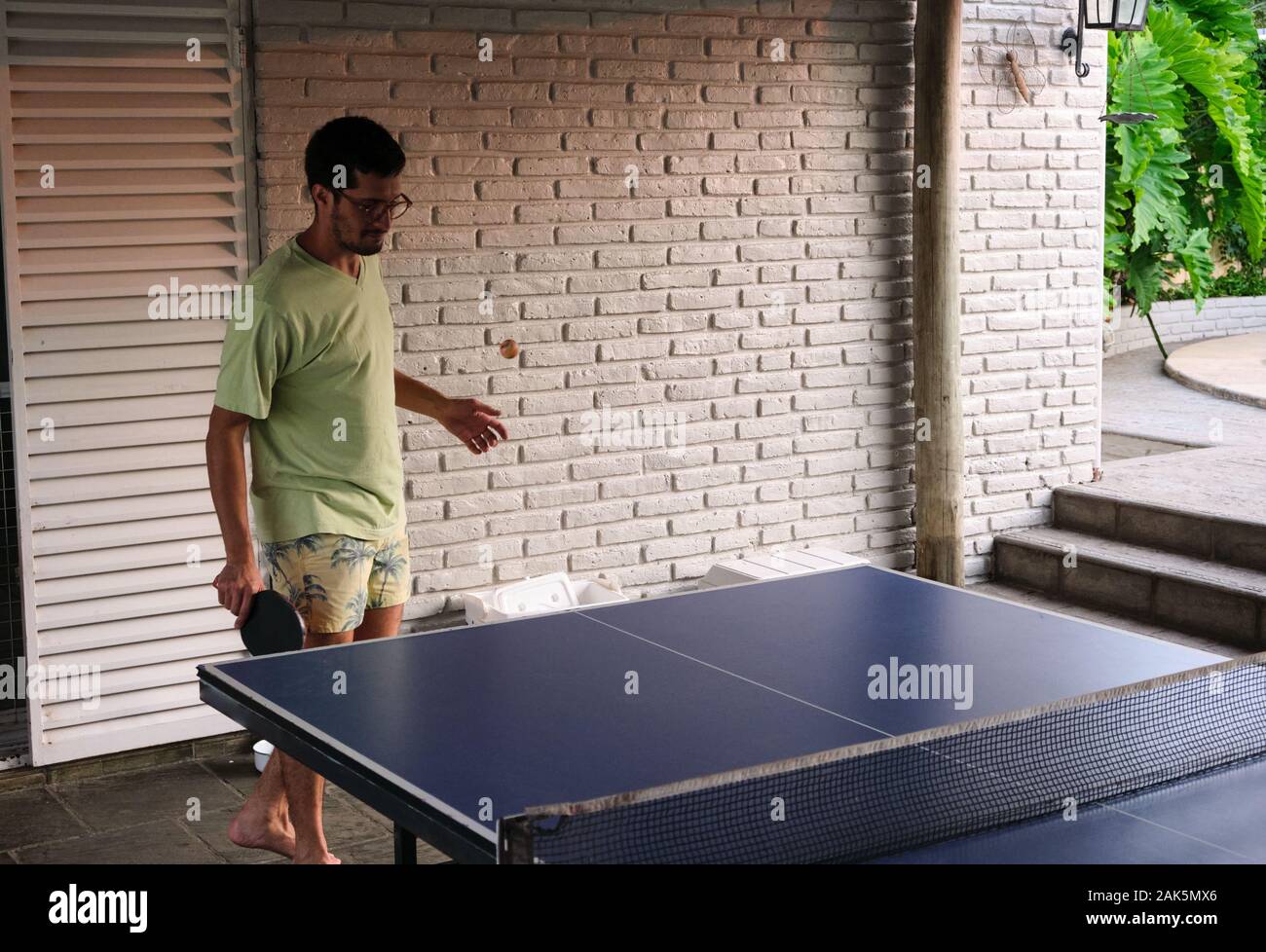 a young men playing table tennis Stock Photo - Alamy