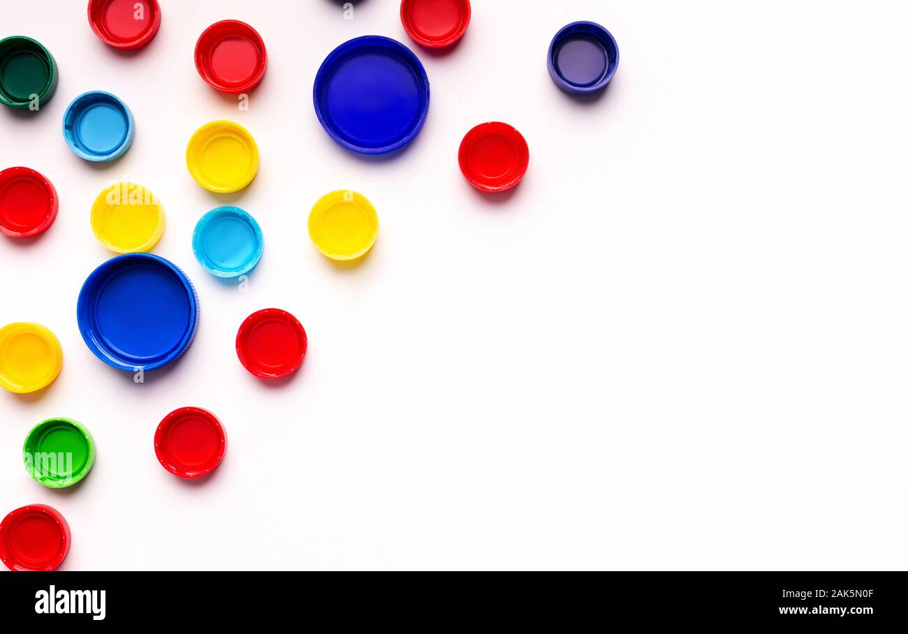 Set of colored plastic covers from bottles isolated on white background ...