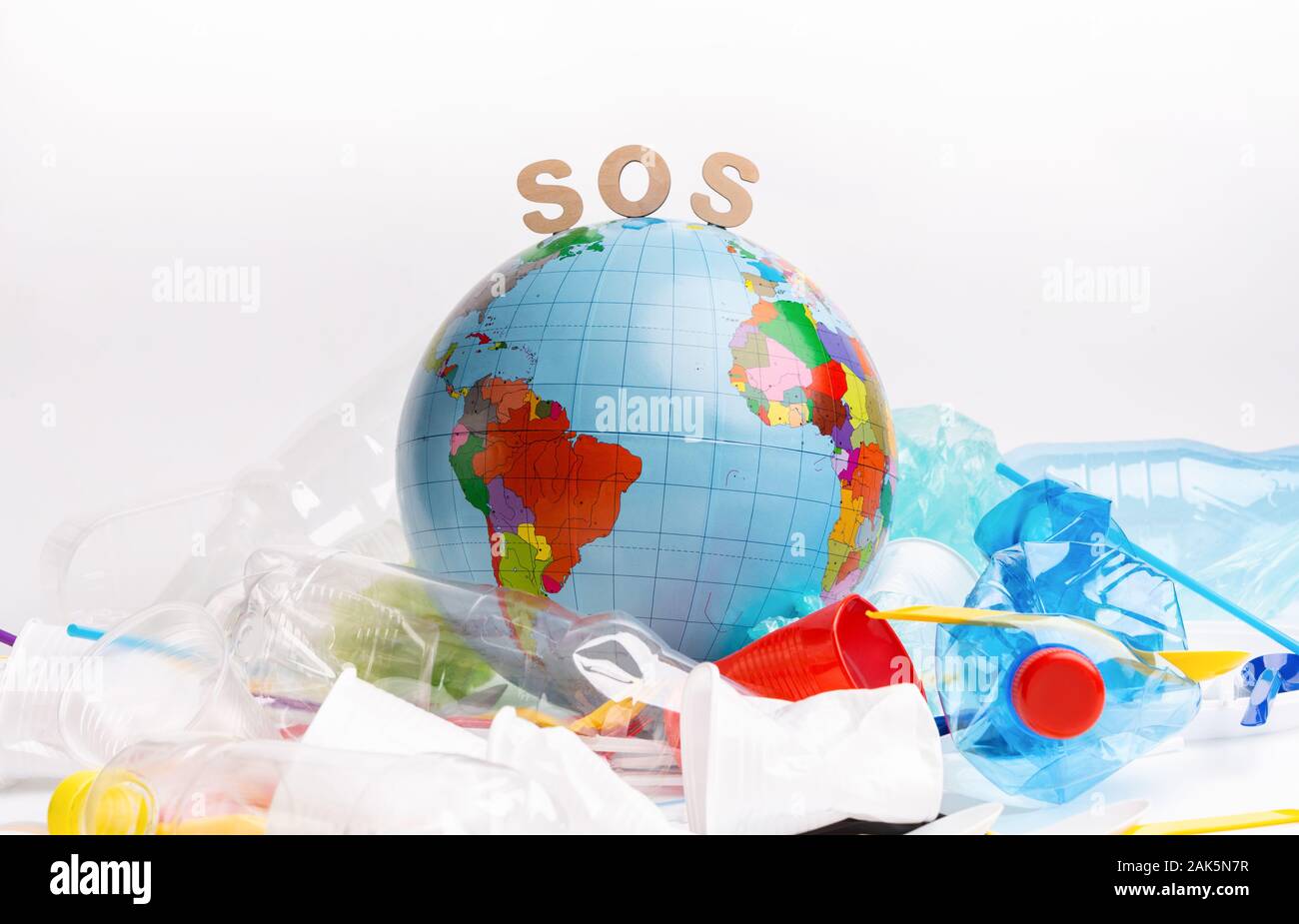 The globe and global pollution by plastic. Planet crying sos or help to ...