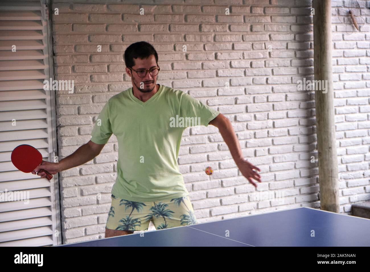 a young men playing table tennis Stock Photo - Alamy
