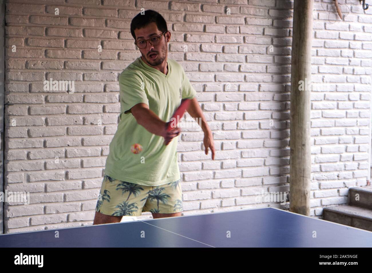 a young men playing table tennis Stock Photo - Alamy