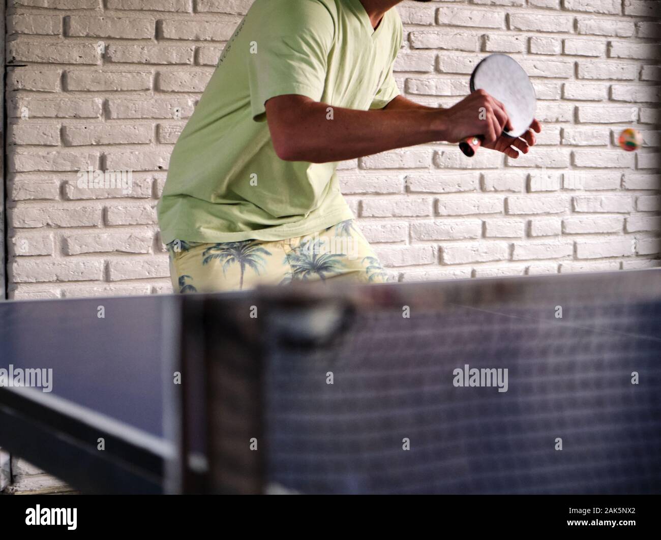 a young men playing table tennis Stock Photo - Alamy