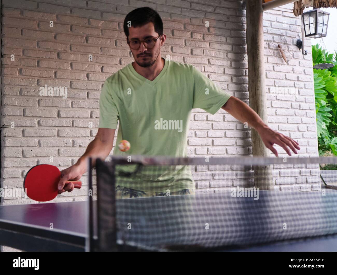 a young men playing table tennis Stock Photo - Alamy
