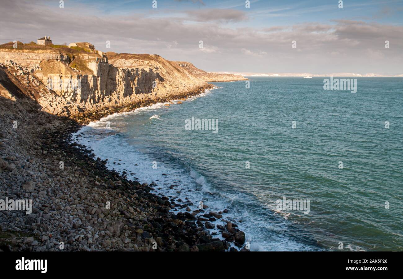 A defensive bunker stands on the heavily quarried cliffs of Portland at ...