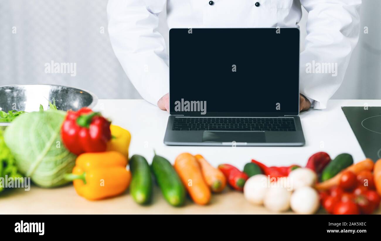 Unrecognizable Chef Man Showing Laptop Blank Screen Standing Next To ...