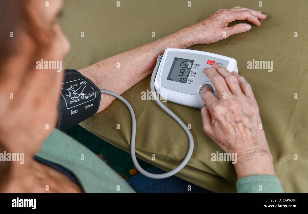 Old woman measuring blood pressure, blood pressure measurement, senior ...