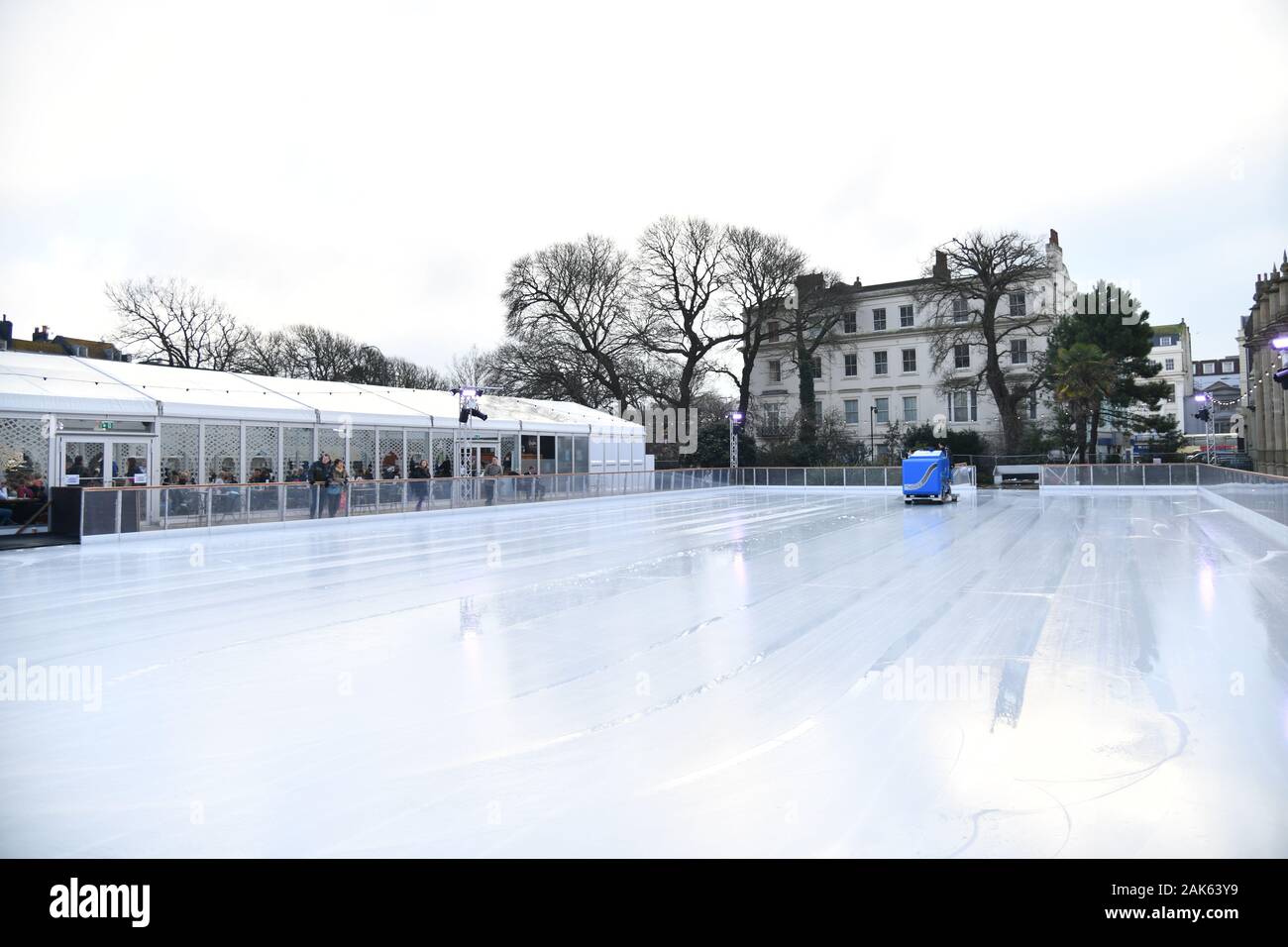 Ice rink surface is being smoothed over before the next set of skaters ...