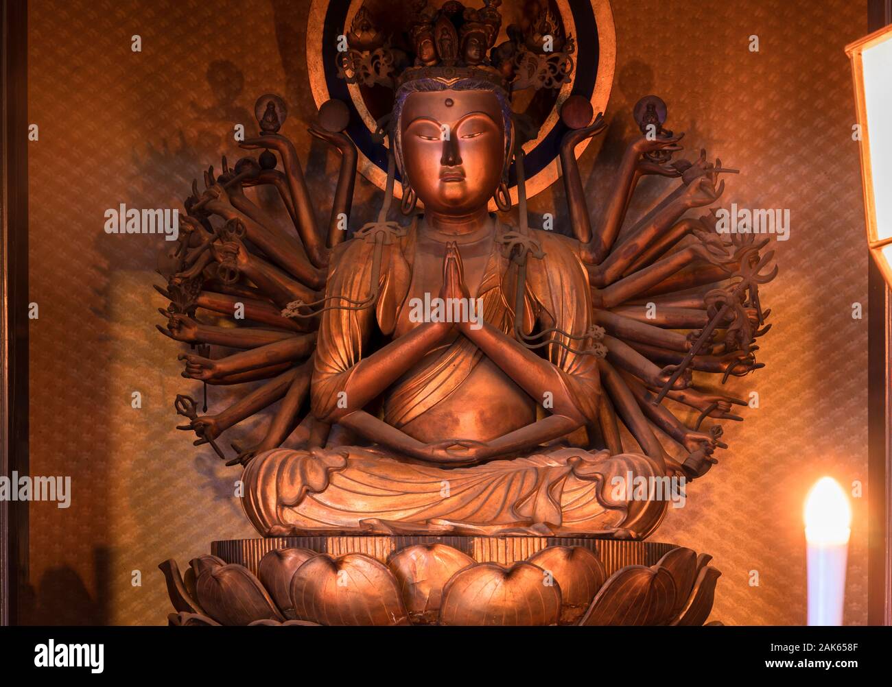 Golden wooden statue depicting the bodhisattva Sente Kannon with ...