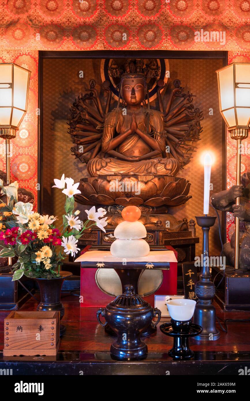 Golden wooden statue depicting the bodhisattva Sente Kannon with ...