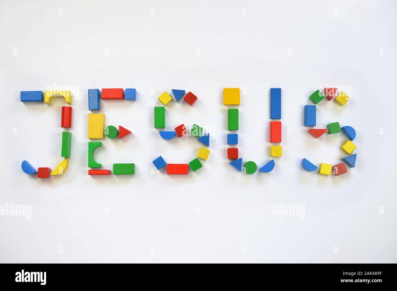 colorful wooden toy blocks lettering the name JESUS Stock Photo - Alamy