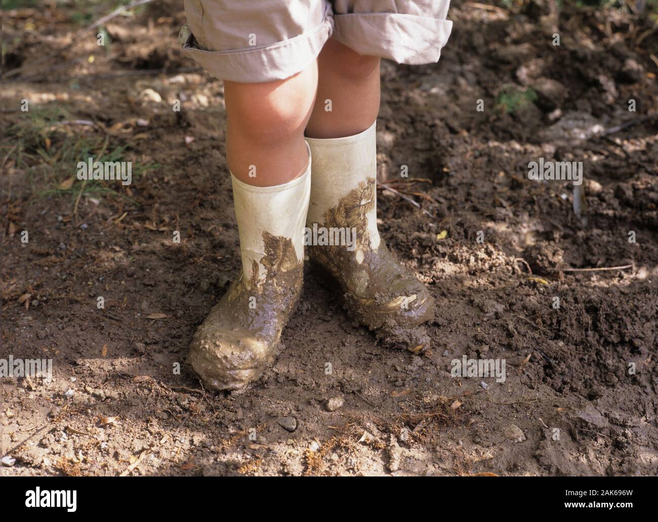 Rubber boots on clay Stock Photo - Alamy