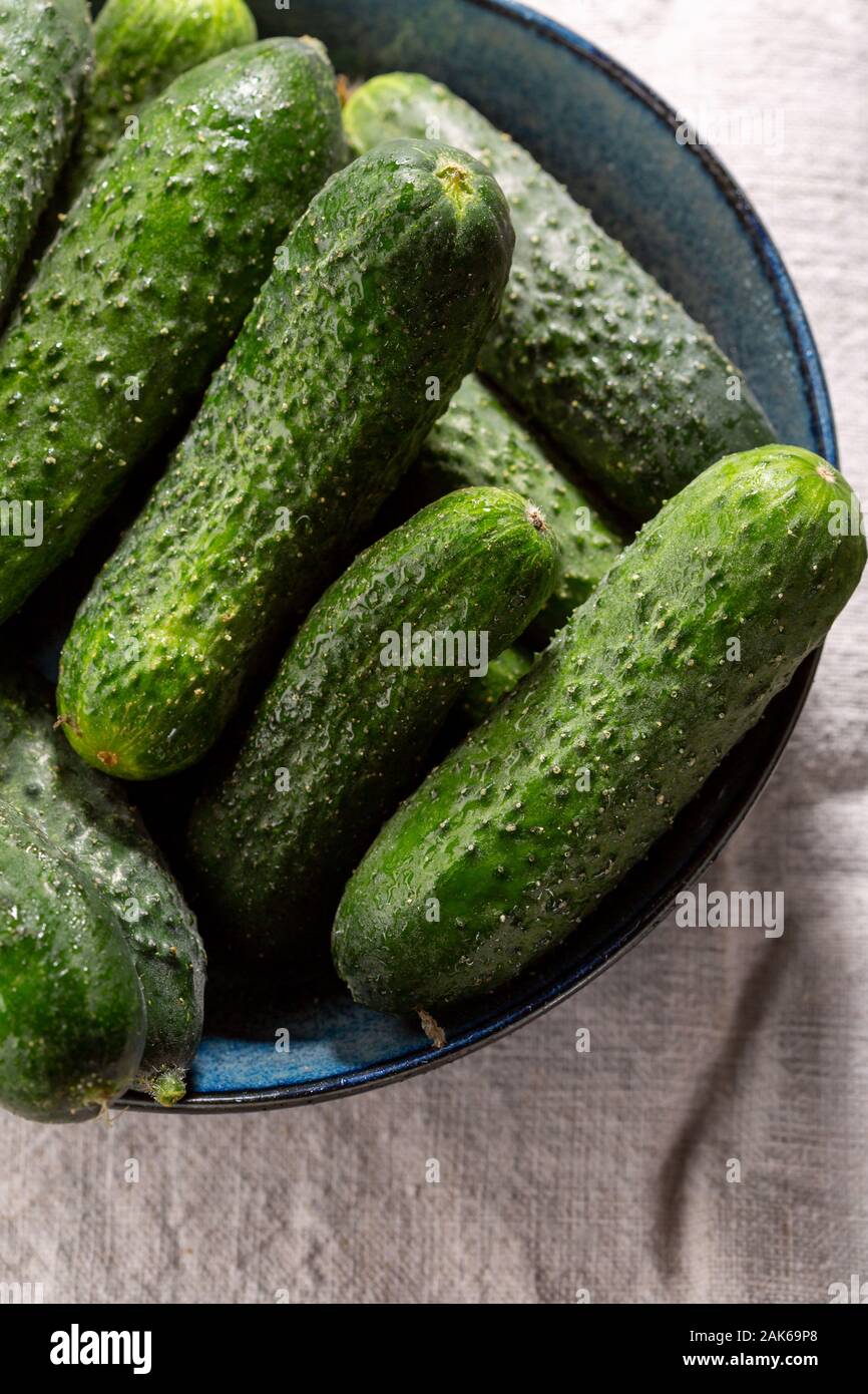 Fresh local cucumbers in bowl, top view healthy food Stock Photo - Alamy