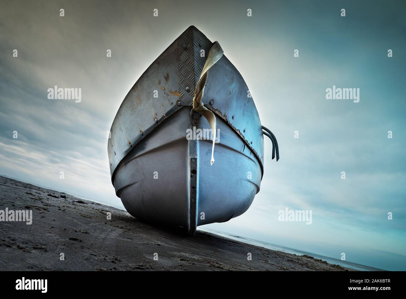 Tired old fishing boat on coast of sea Stock Photo - Alamy