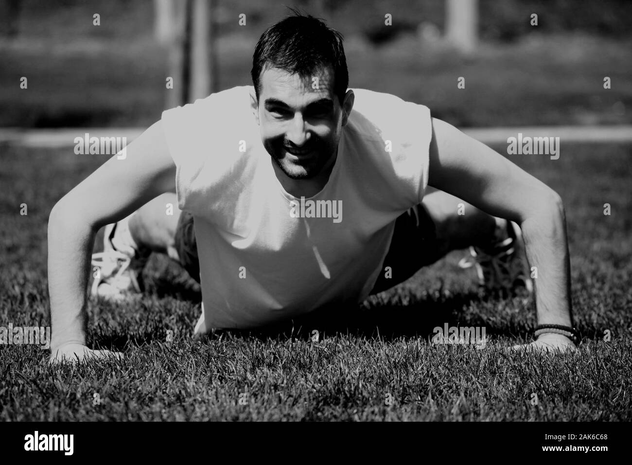 doing push-ups at the park Stock Photo - Alamy