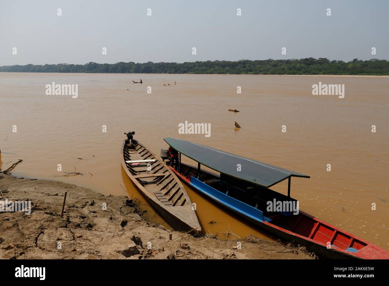 Typical jungle boats on the banks of the Amazonas river with jungle ...