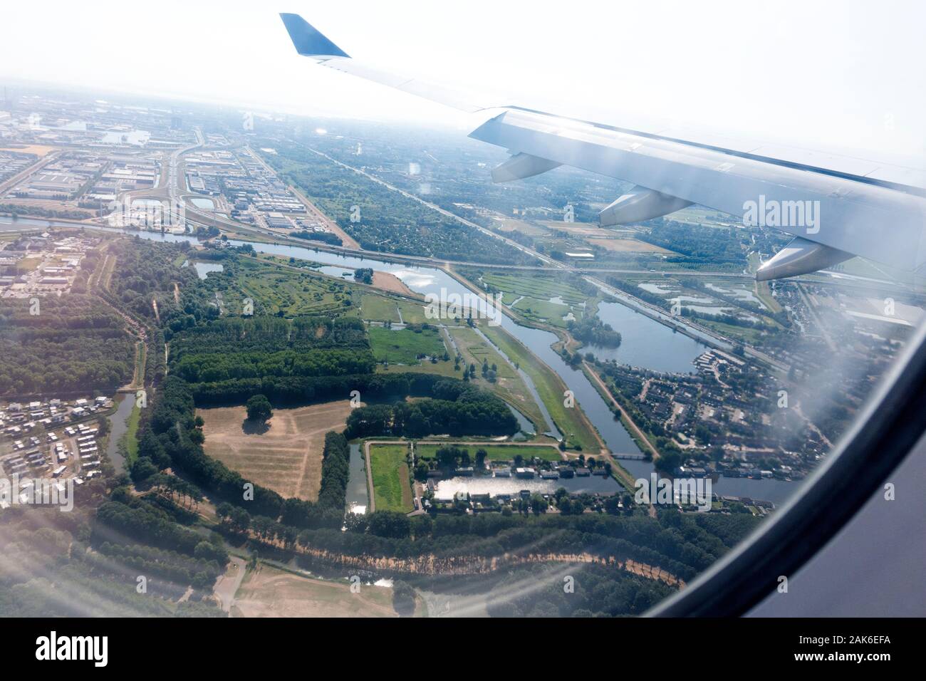 Overhead view of urban Amsterdam from airplane window. Amsterdam ...