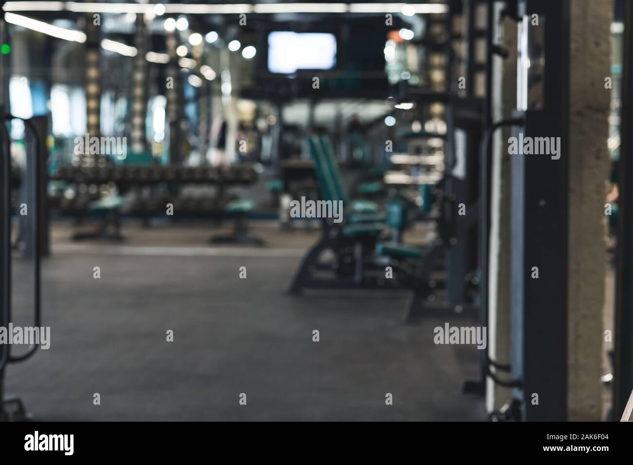 Dark empty gym interior with training equipment, free space Stock Photo ...
