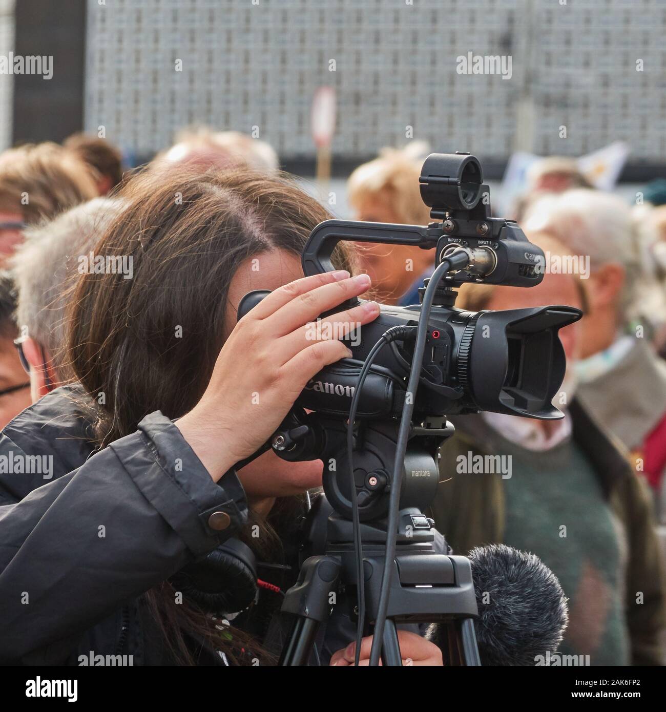 Braunschweig, Germany, September 20., 2019: woman with camera stands ...