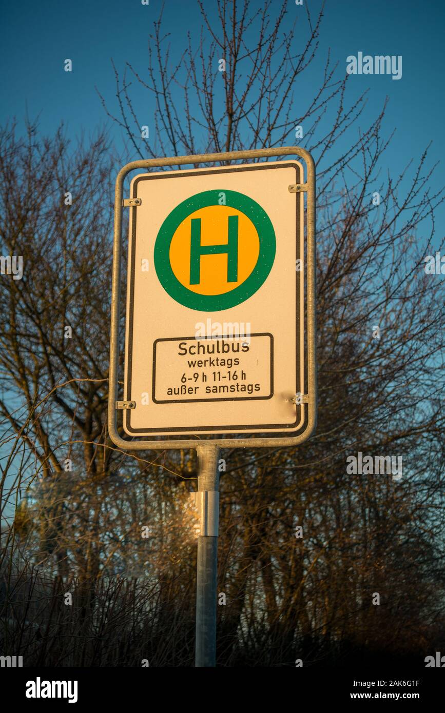 View of sign in german indicating school bus stop and the schedule ...