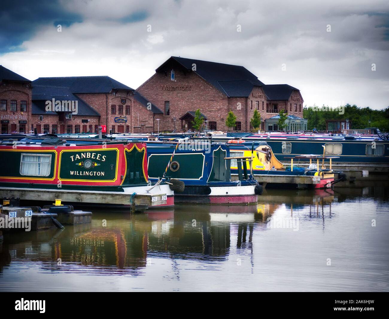 Narrowboats on their moorings at Barton Turns Marina Stock Photo - Alamy
