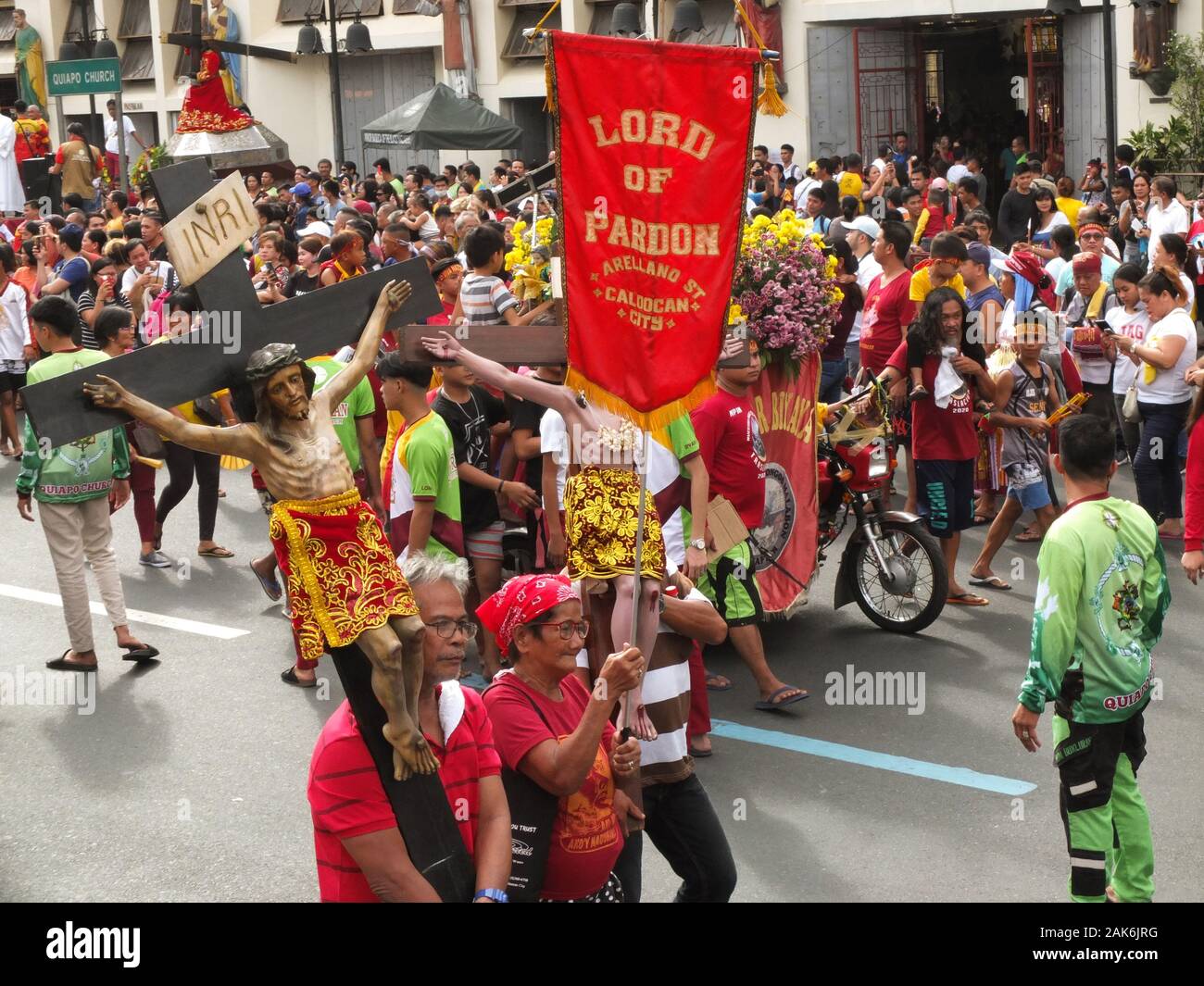 A religious group, the Lord of Pardon hold their replica of a crucified ...