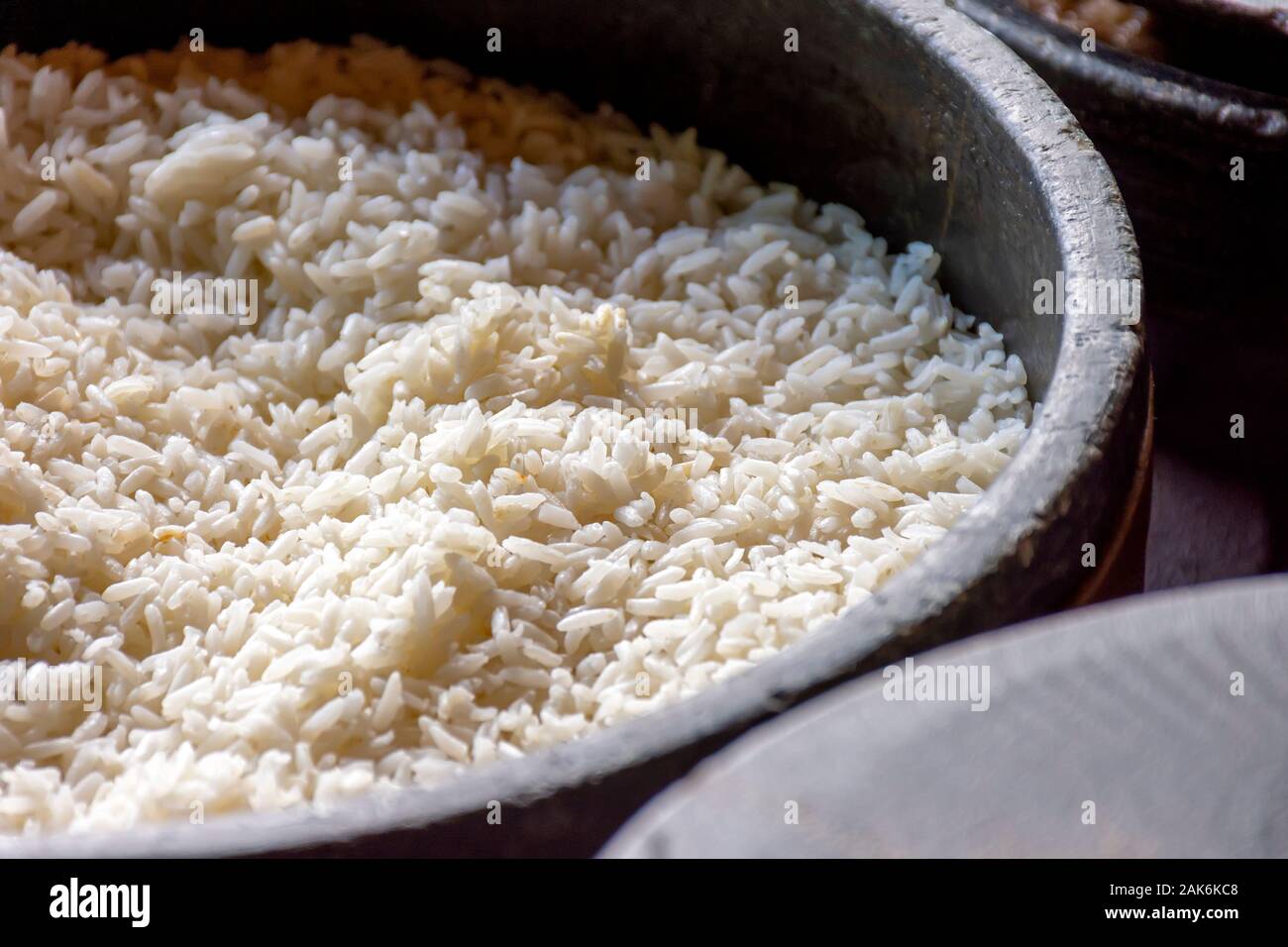 Freshly prepared white rice ready to serve in a traditional clay pot ...