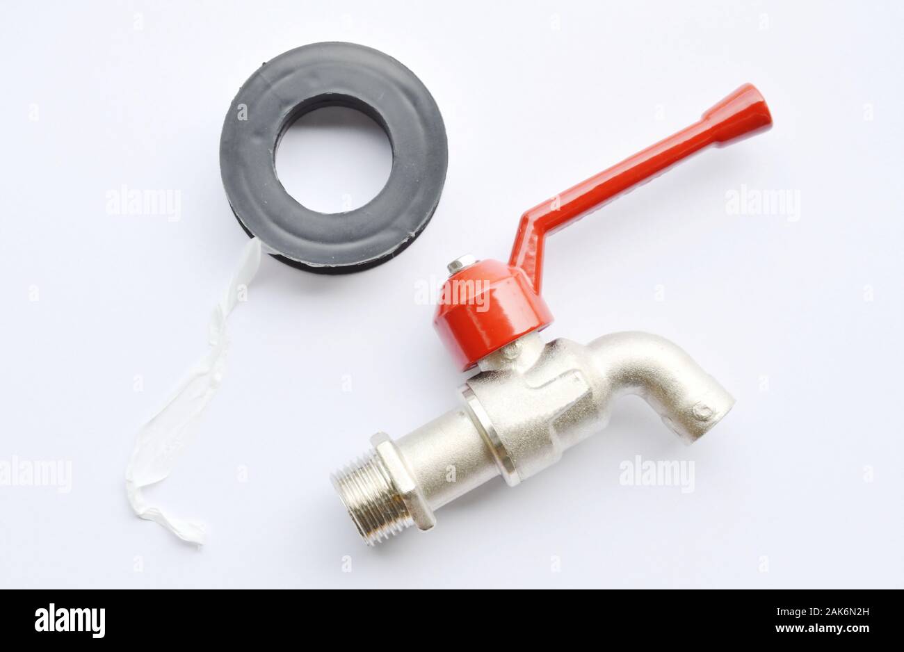 iron water tap spare parts and roll sealed tape on white background ...