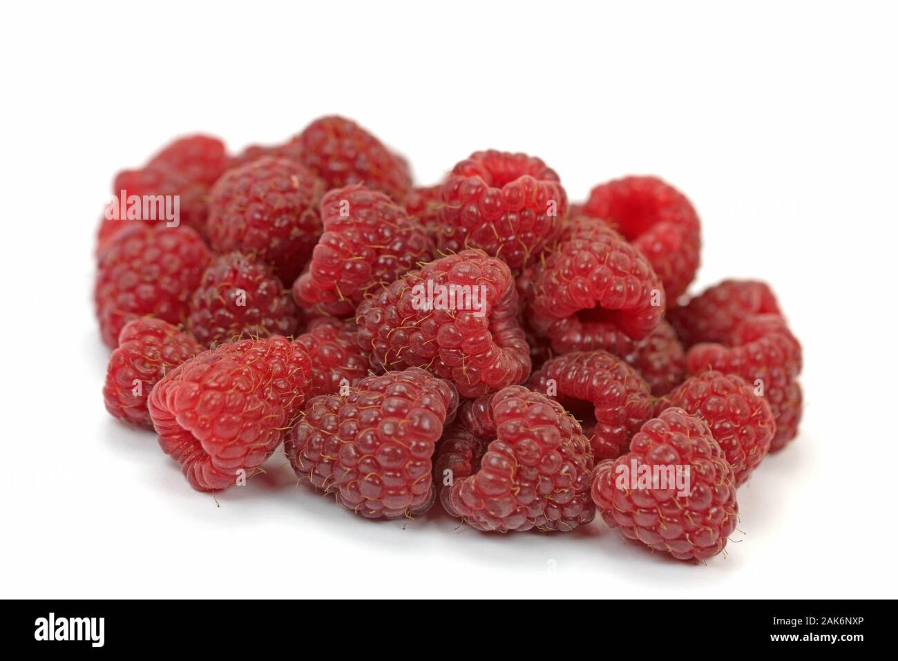 Raspberries against a white background Stock Photo - Alamy