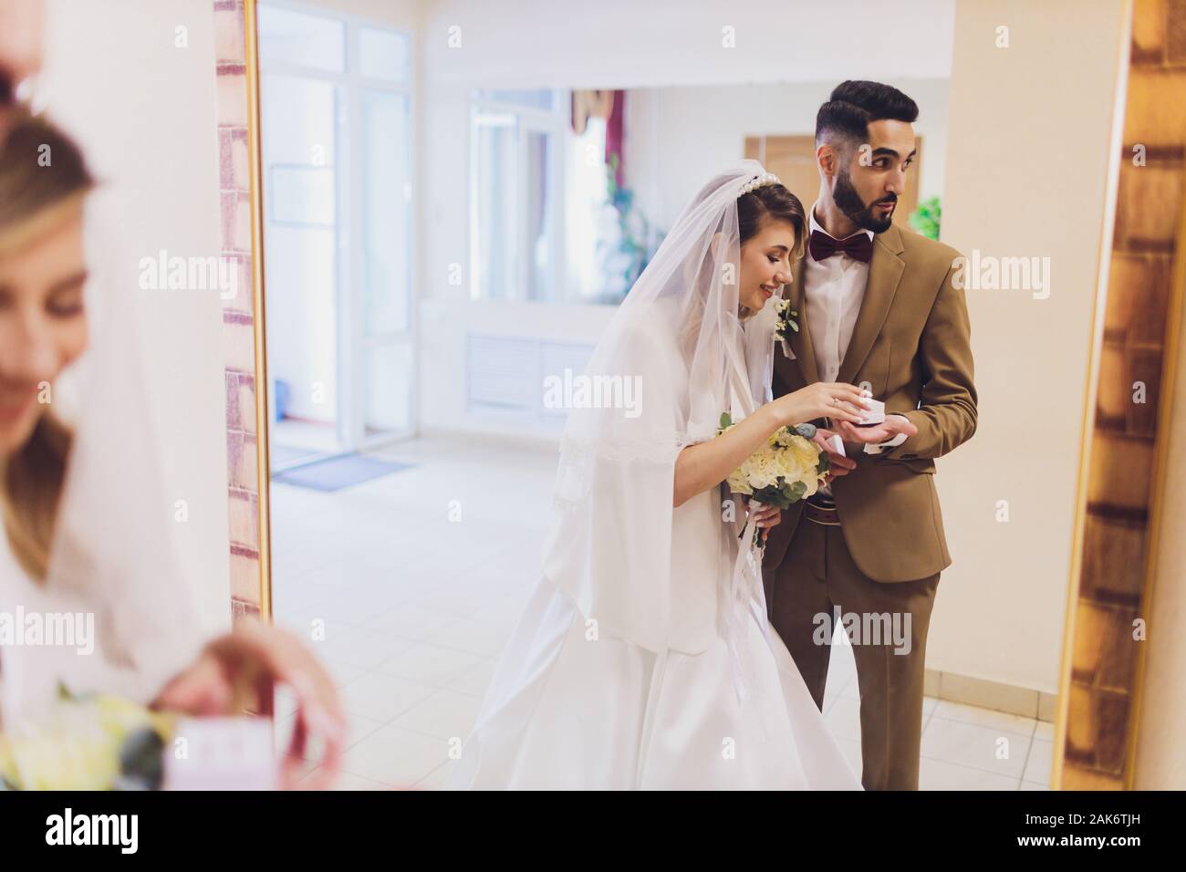 newlyweds append signatures in a registry office during wedding ...