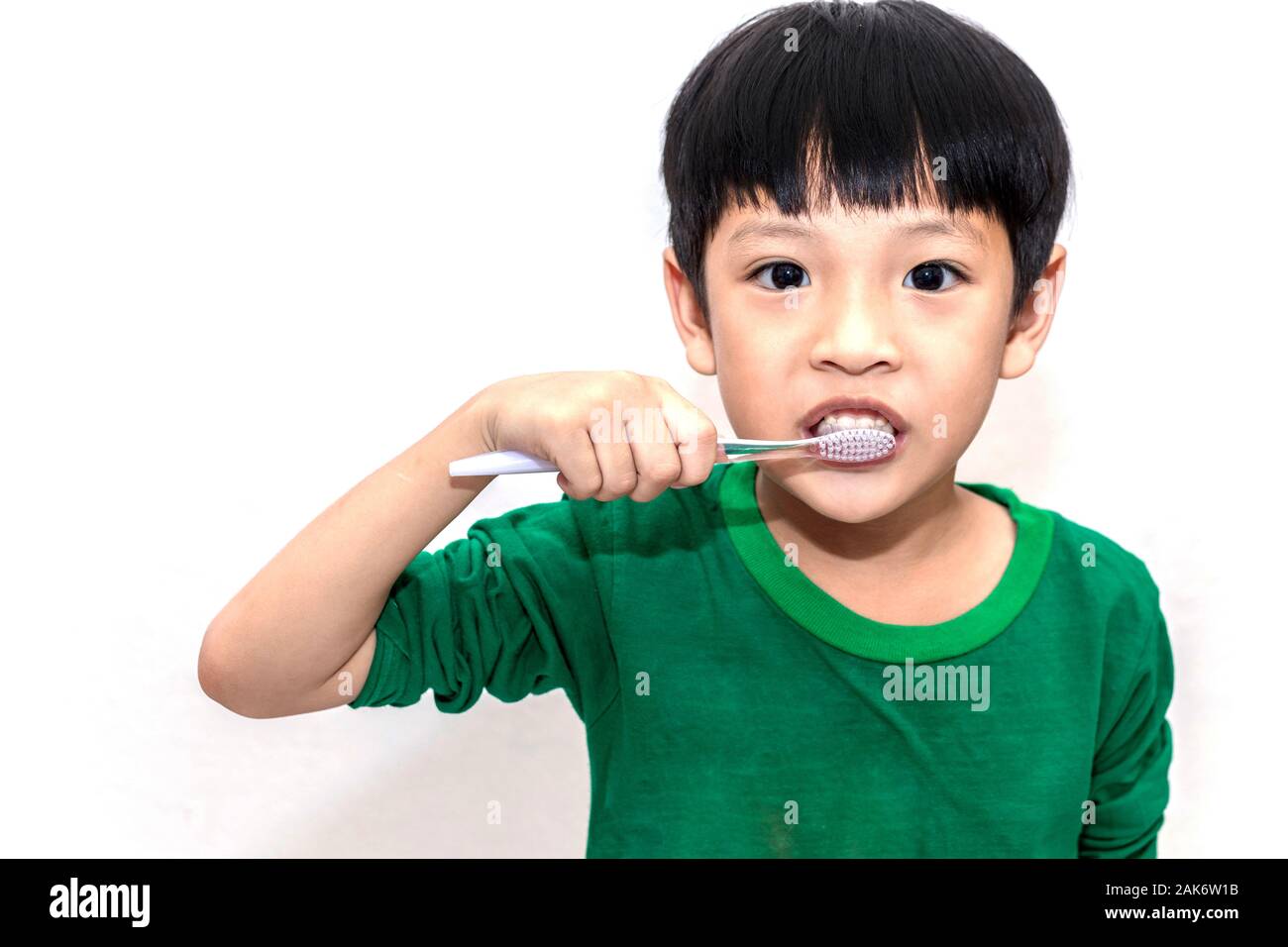 Hispanic Boy Brushing Teeth