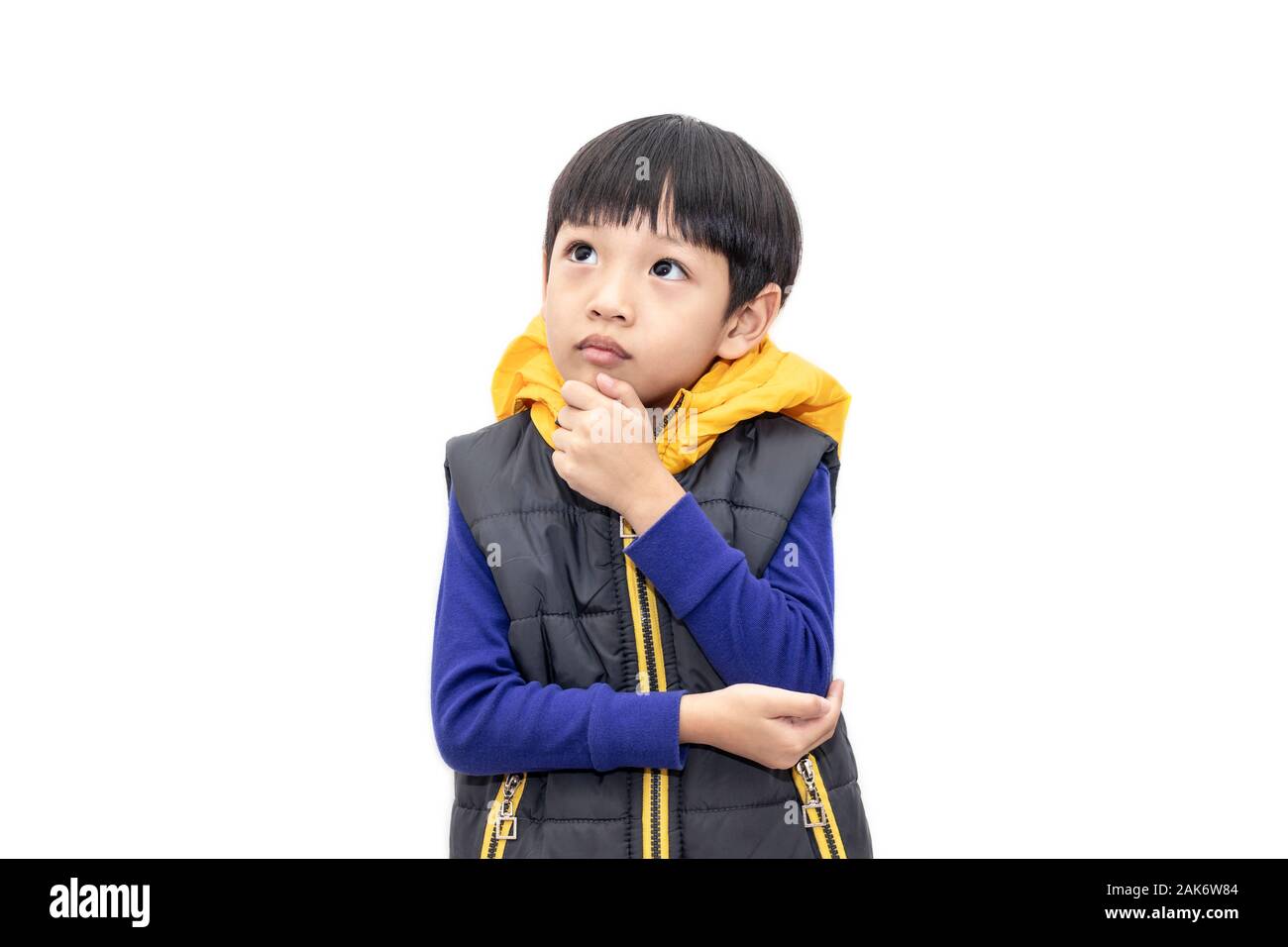 Child looking up isolated on white background. Little boy thinking with ...