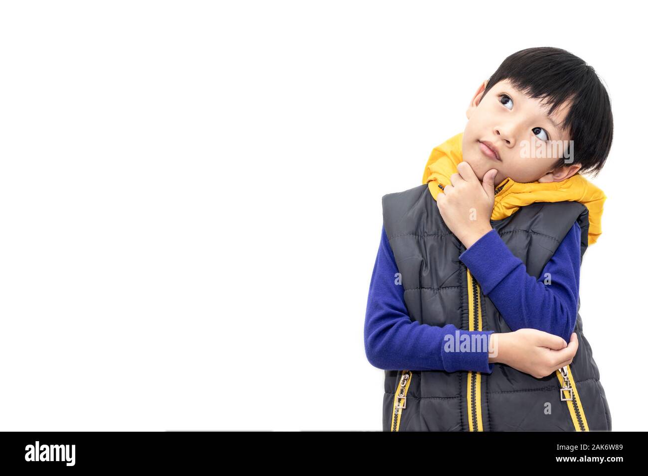 Child looking up isolated on white background. Little boy thinking with ...