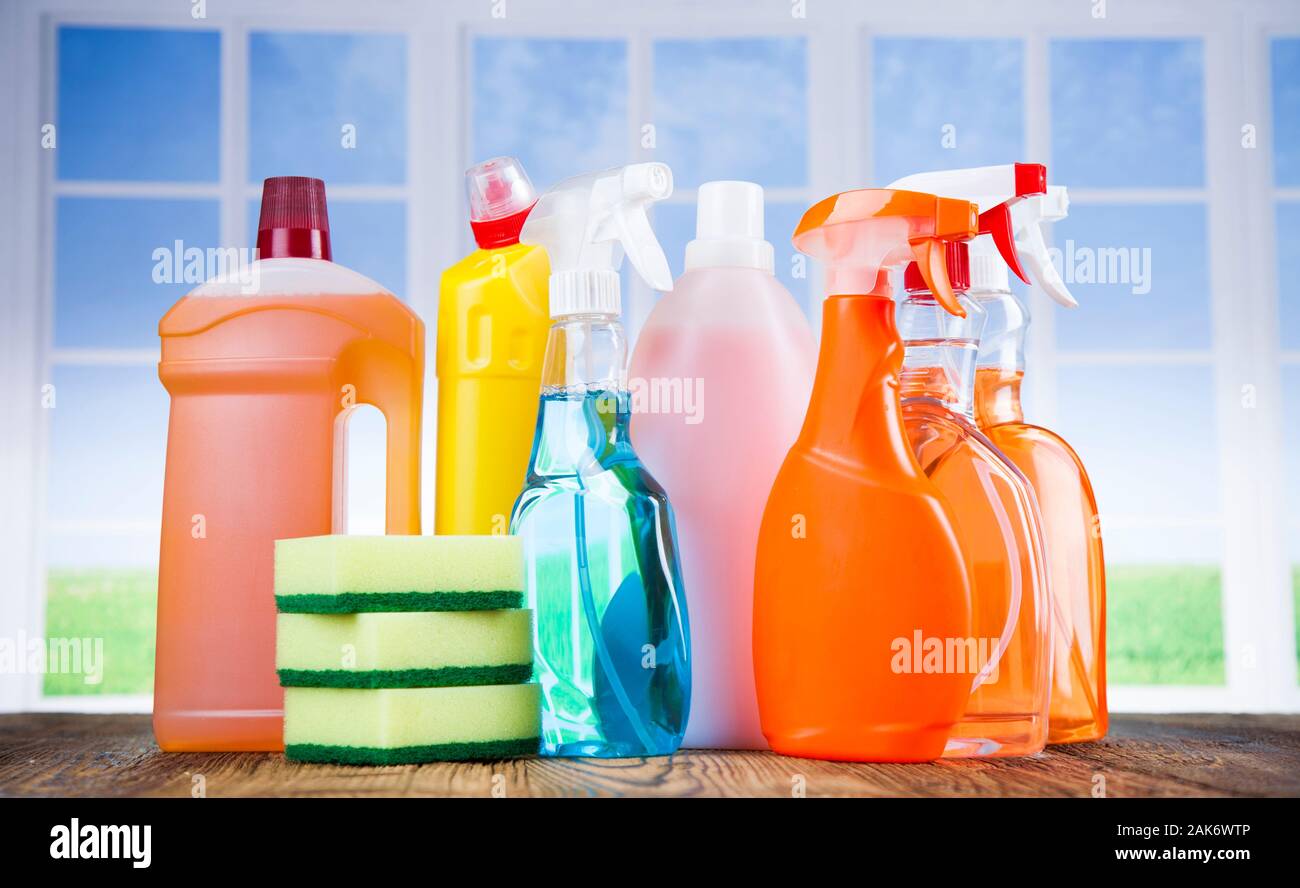 House cleaning product on wood table and window background Stock Photo ...