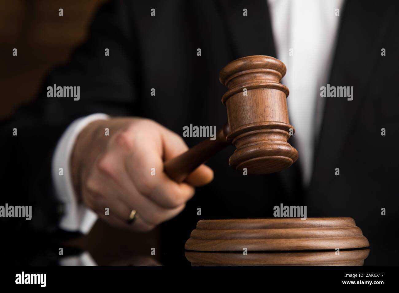 Judge, male judge in a courtroom striking the gavel Stock Photo - Alamy