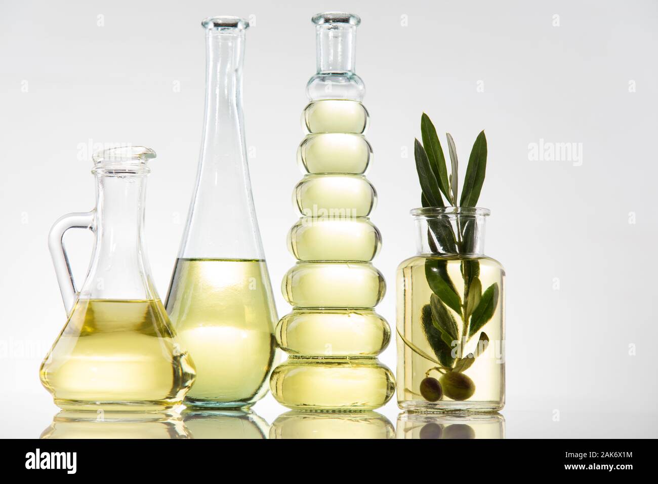 Olive oil bottles, olive branch and Cooking oils Stock Photo - Alamy
