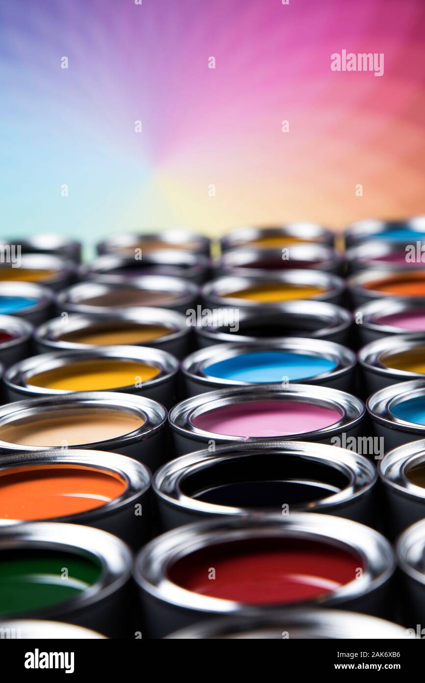 Group of tin metal cans with color paint Stock Photo - Alamy