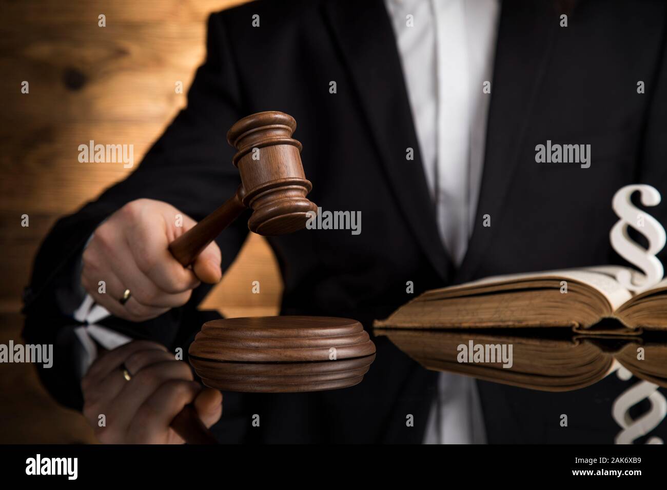 Judge, male judge in a courtroom striking the gavel Stock Photo - Alamy
