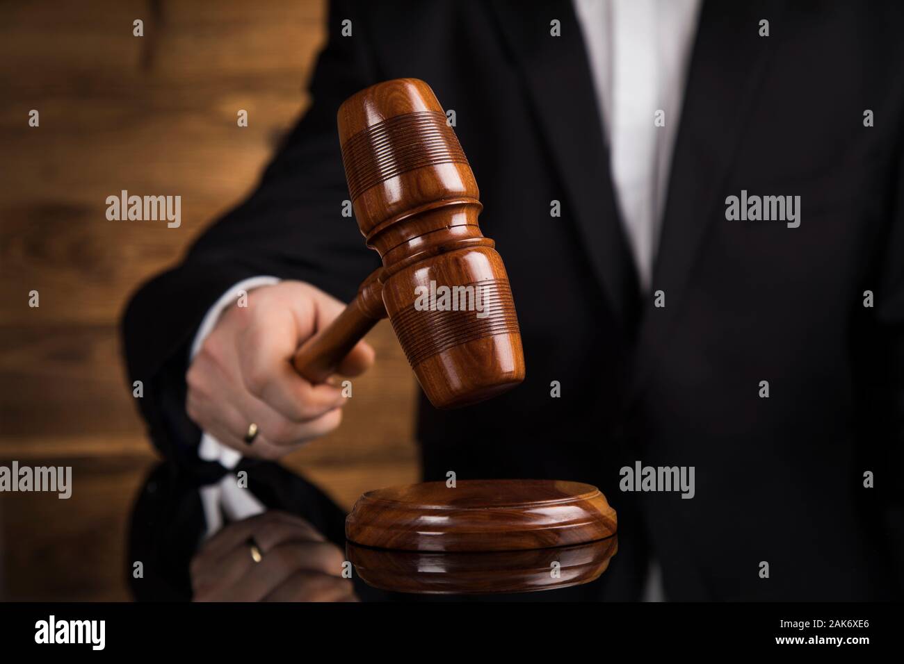 Judge, male judge in a courtroom striking the gavel Stock Photo - Alamy