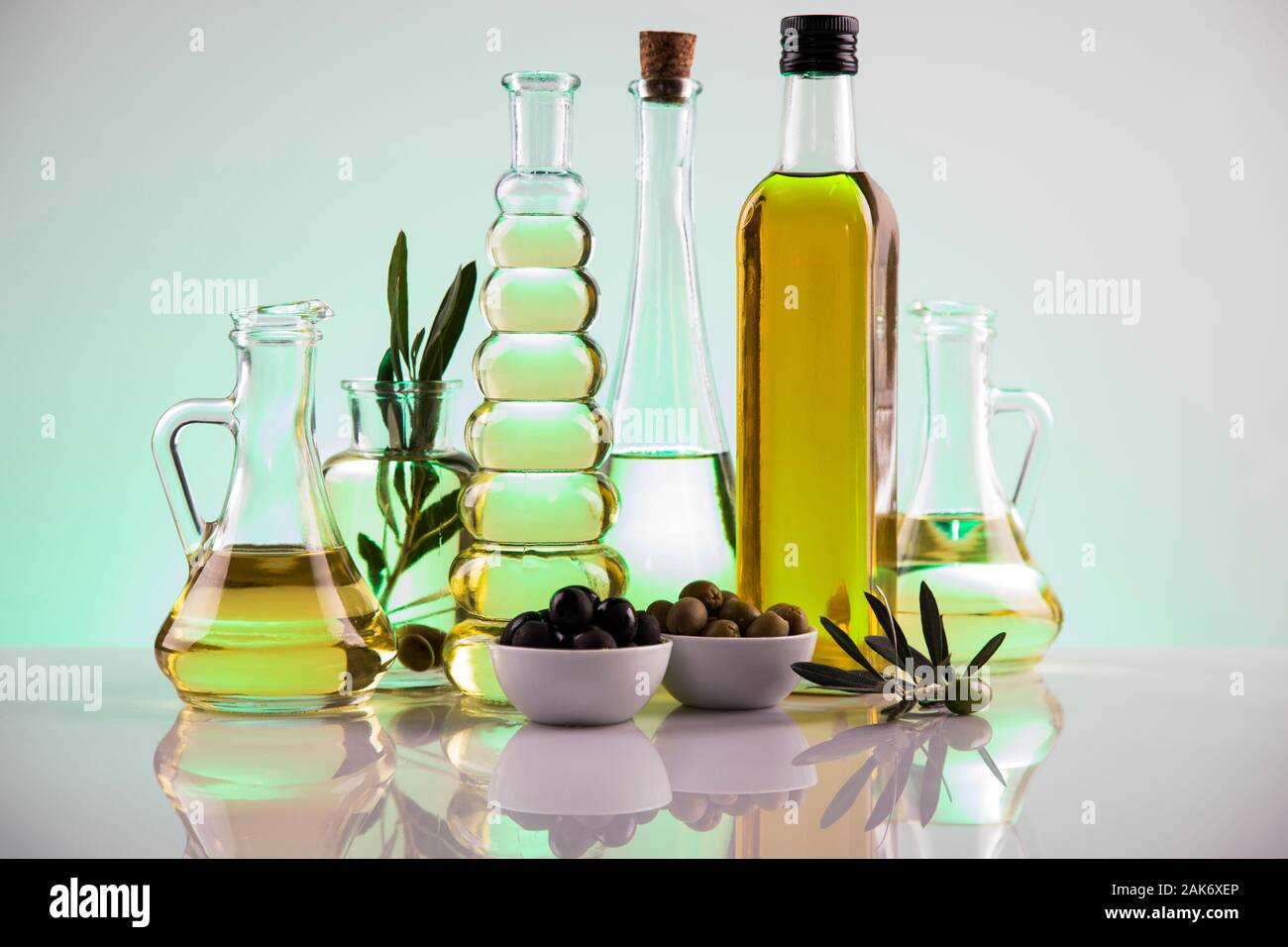 Bottles of olive oil, olive branch and Cooking oils Stock Photo - Alamy