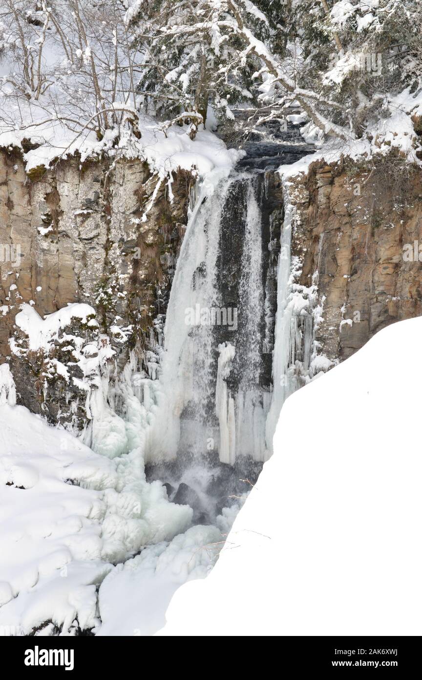 A beautiful frozen waterfall during winter in a snowy landscape Stock ...