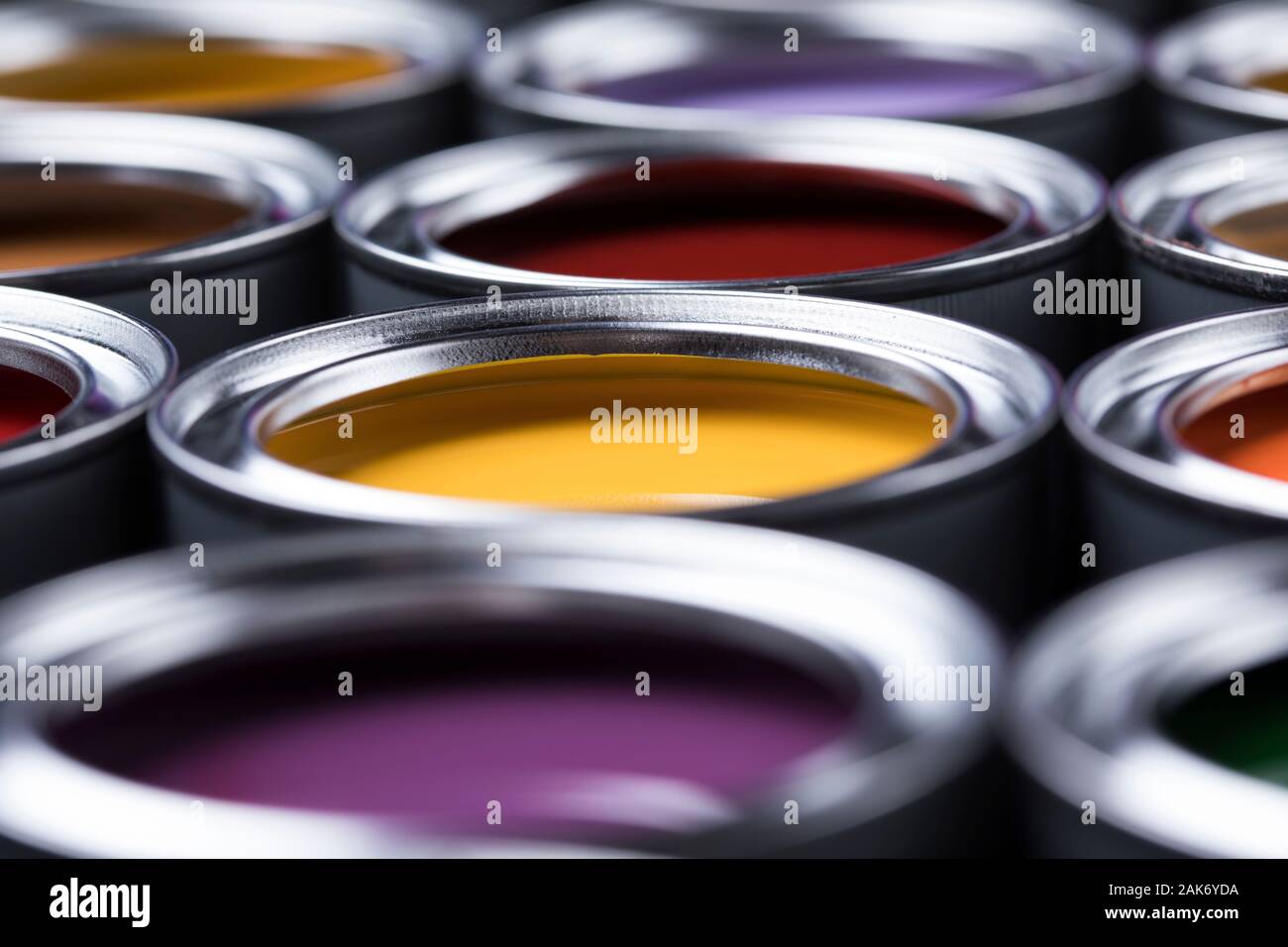 Group of tin metal cans with color paint Stock Photo - Alamy