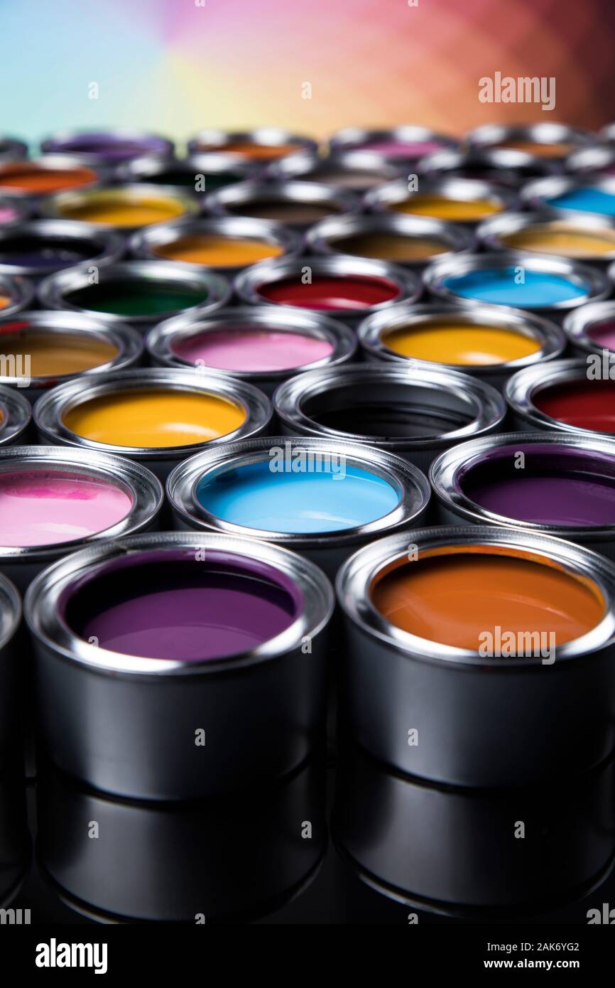 Group of tin metal cans with color paint Stock Photo - Alamy