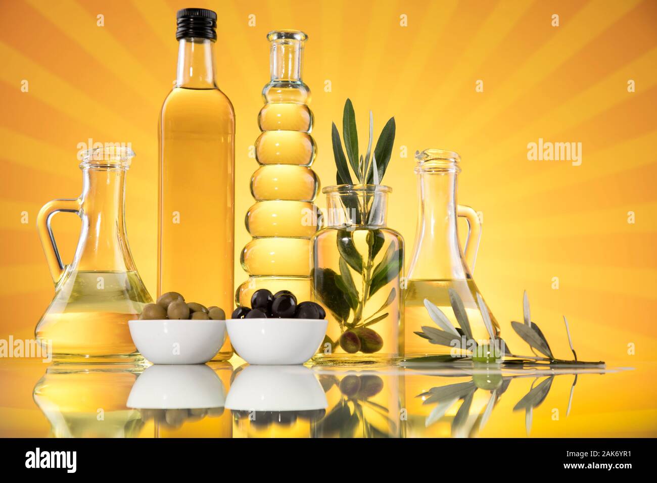 Bottles of olive oil, olive branch and Cooking oils Stock Photo - Alamy